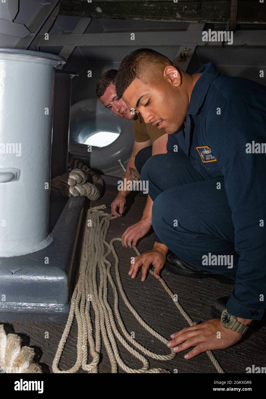 Boatswain’s Mate Seaman Kyle Caliver, front, from San Diego, and ...