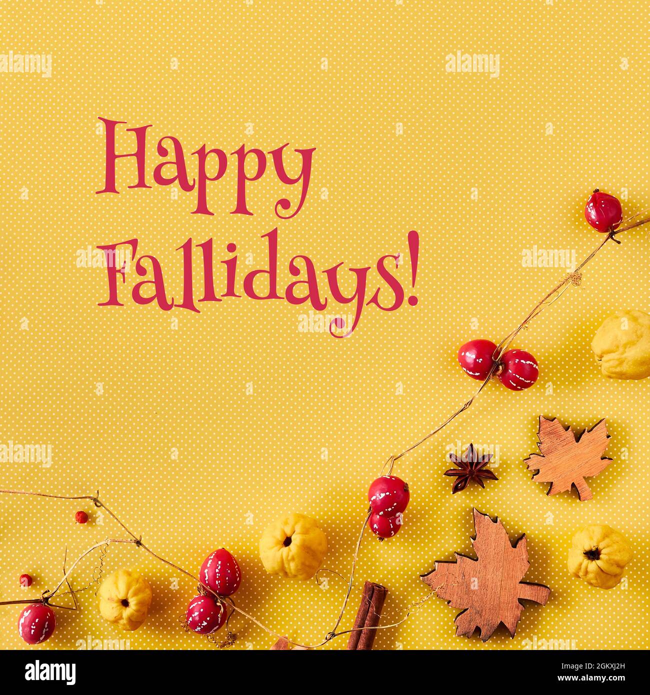 Text Happy Fallidays. Autumn decorations on yellow paper. Quince fruits ...