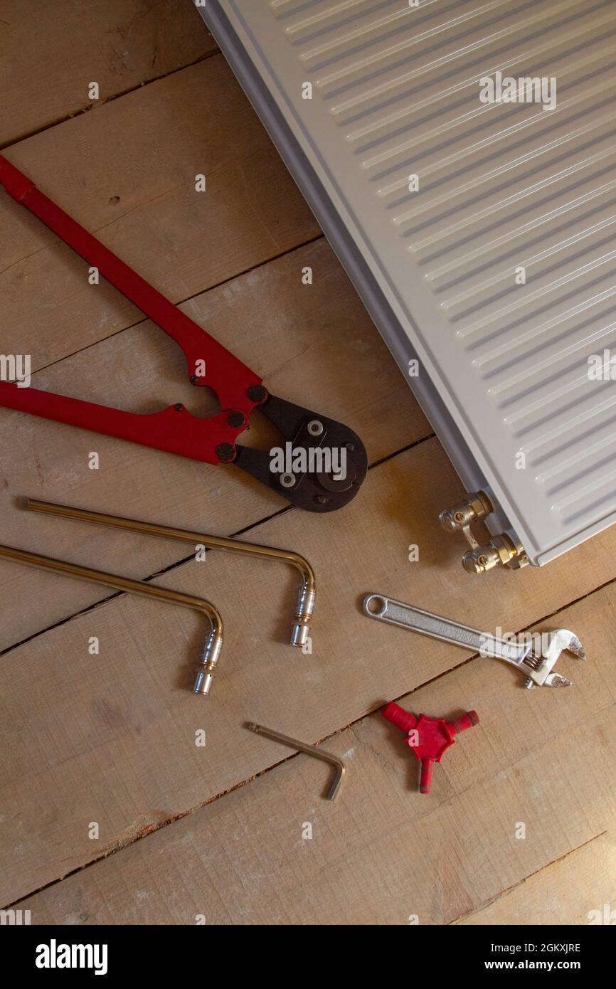 Steel tools for installing radiators and plumbing. The concept of ...