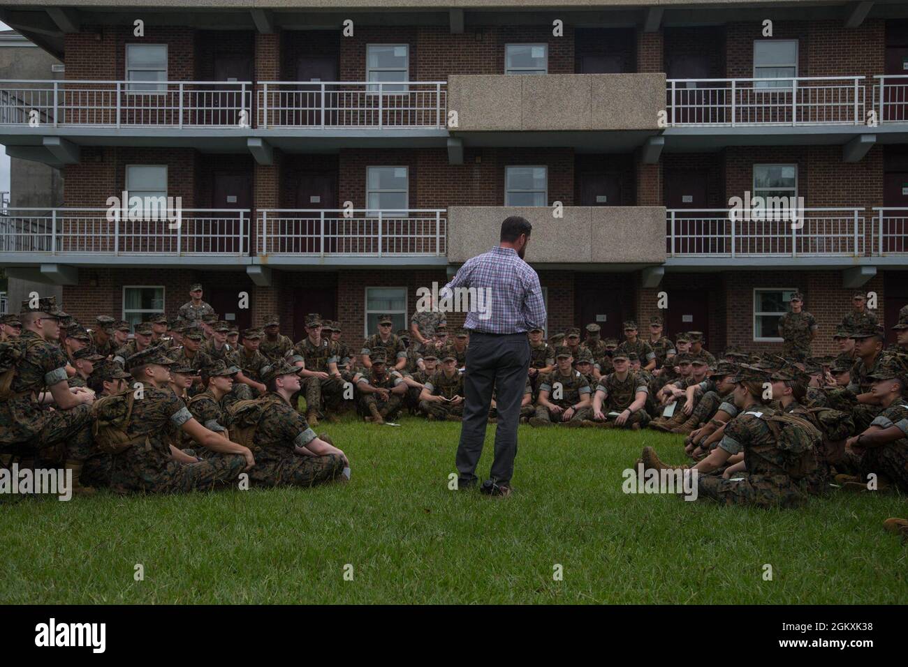 U.S. Marine Corps retired Master Gunnery Sgt. Adam Walker speaks to ...