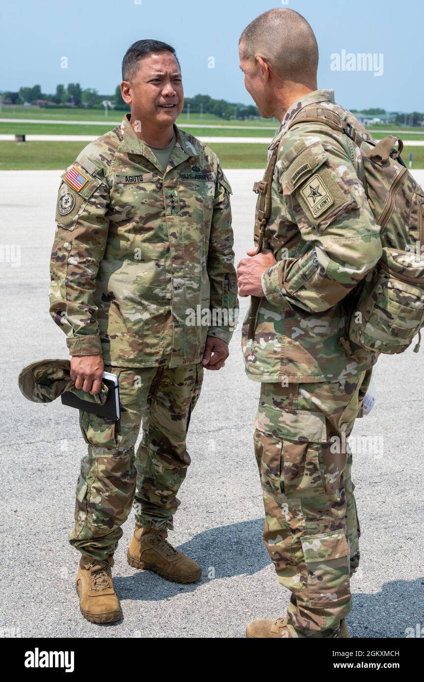 Lt. Gen. Antonio Aguto, the commander of First Army, left, greets ...