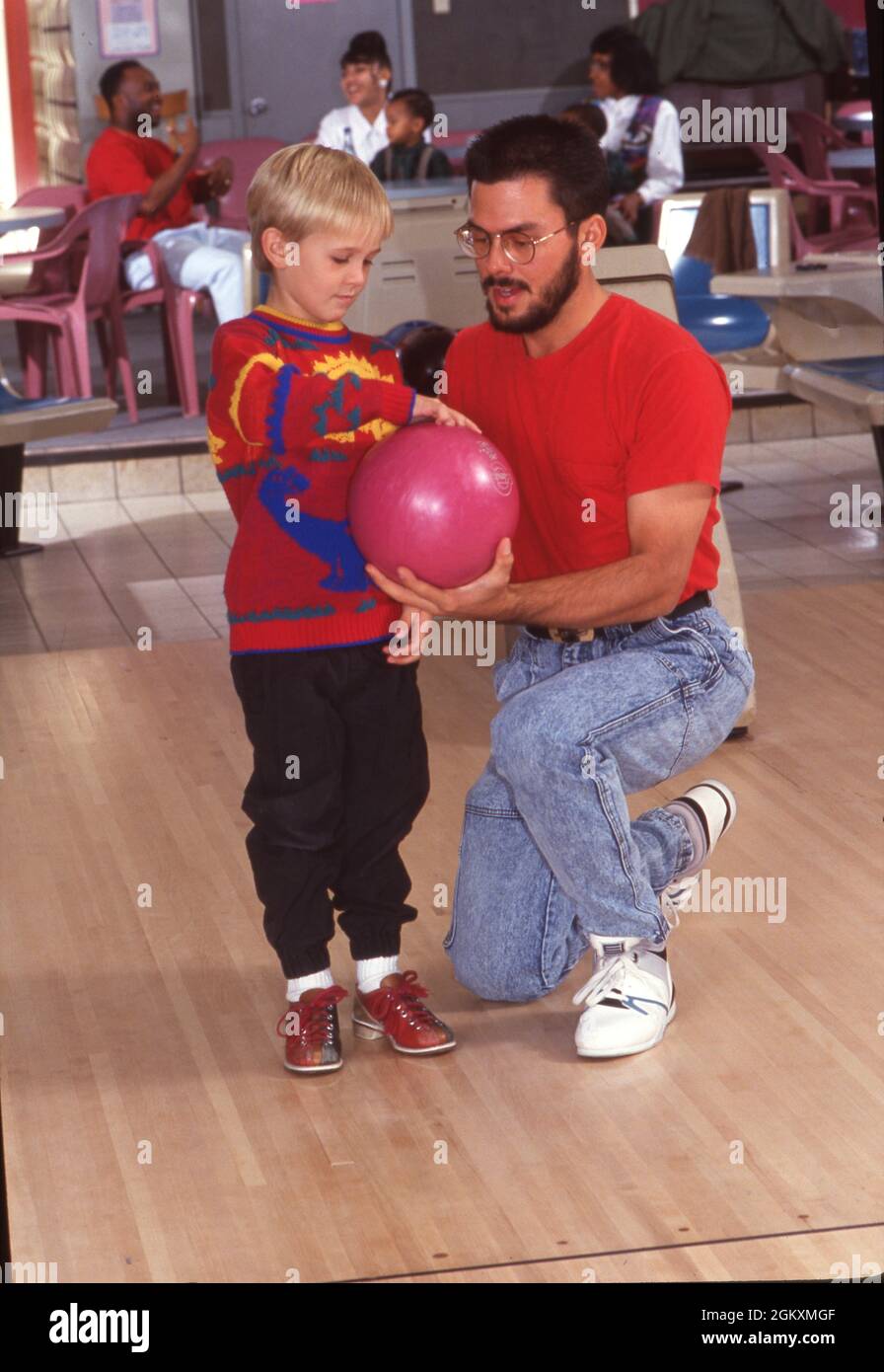 ©1992 Recreational Sports: Dad and son bowling MR Stock Photo - Alamy