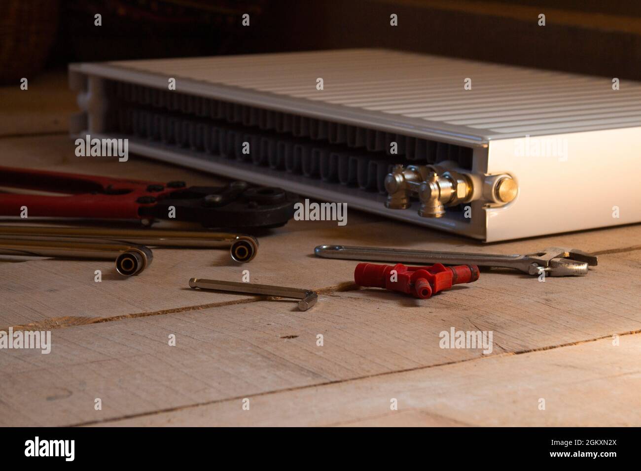steel radiator and assembly tool. Heating repair concept Stock Photo ...