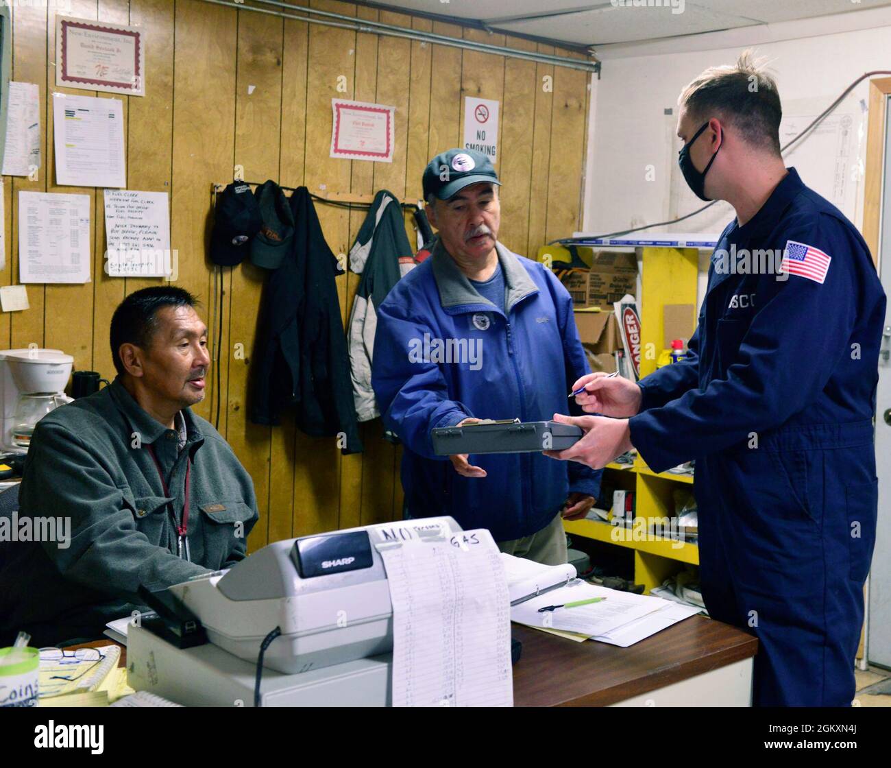 Petty Officer 3rd Class Jonathan Holman (right), a marine science ...