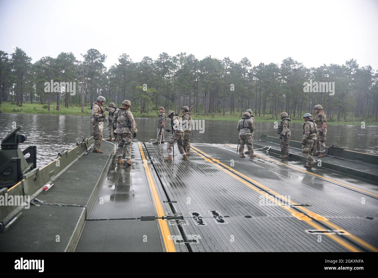 Soldiers from the 926th Engineer Brigade work tirelessly on a buoyant ...
