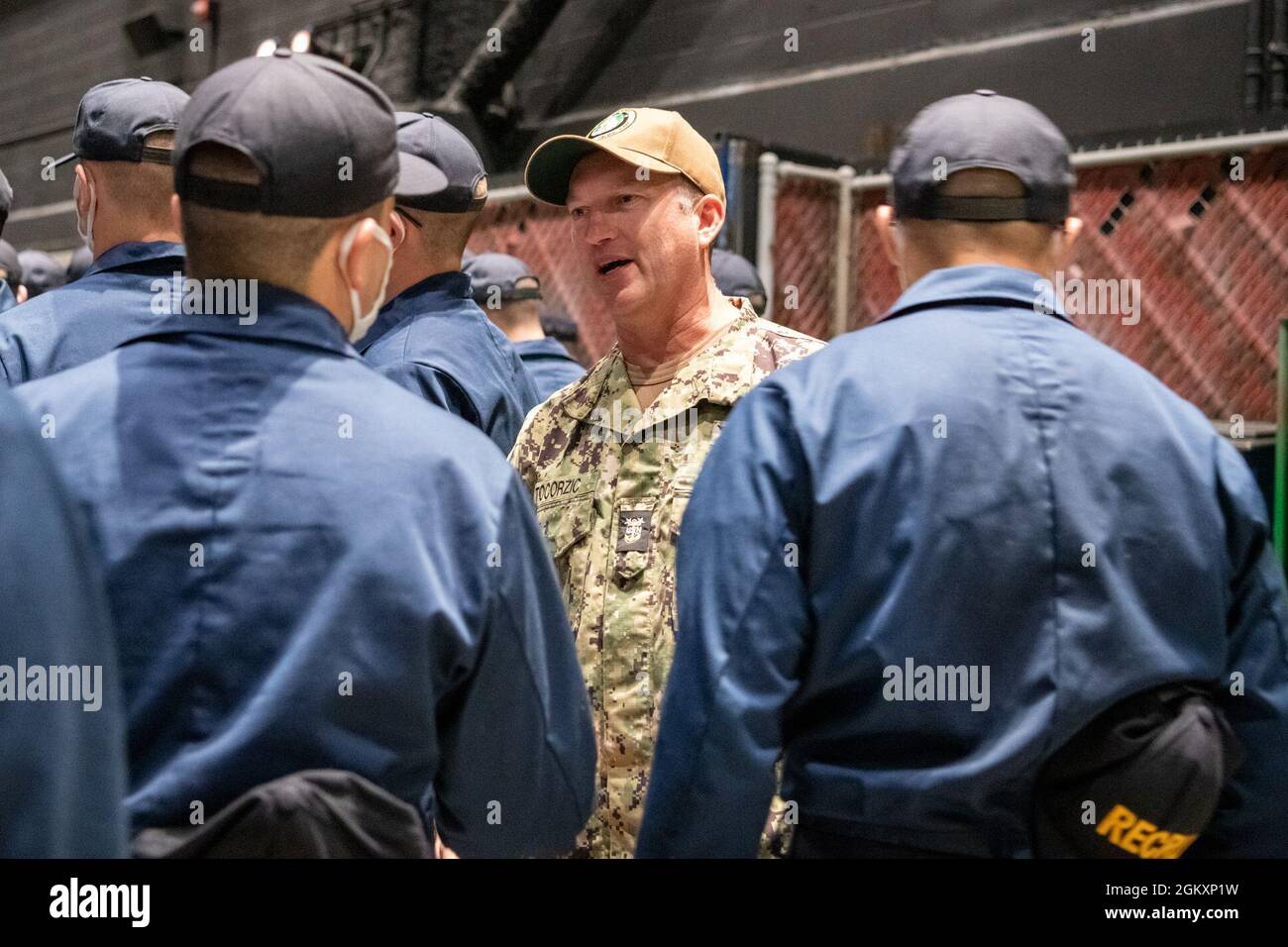 U.S. Pacific Fleet Master Chief Smitty Tocorzic congratulates recruits ...