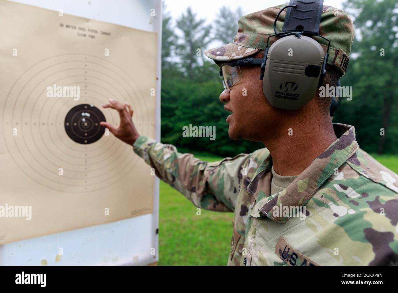 Sgt. Stanley Thompson, 108th Training Command, checks his target after ...