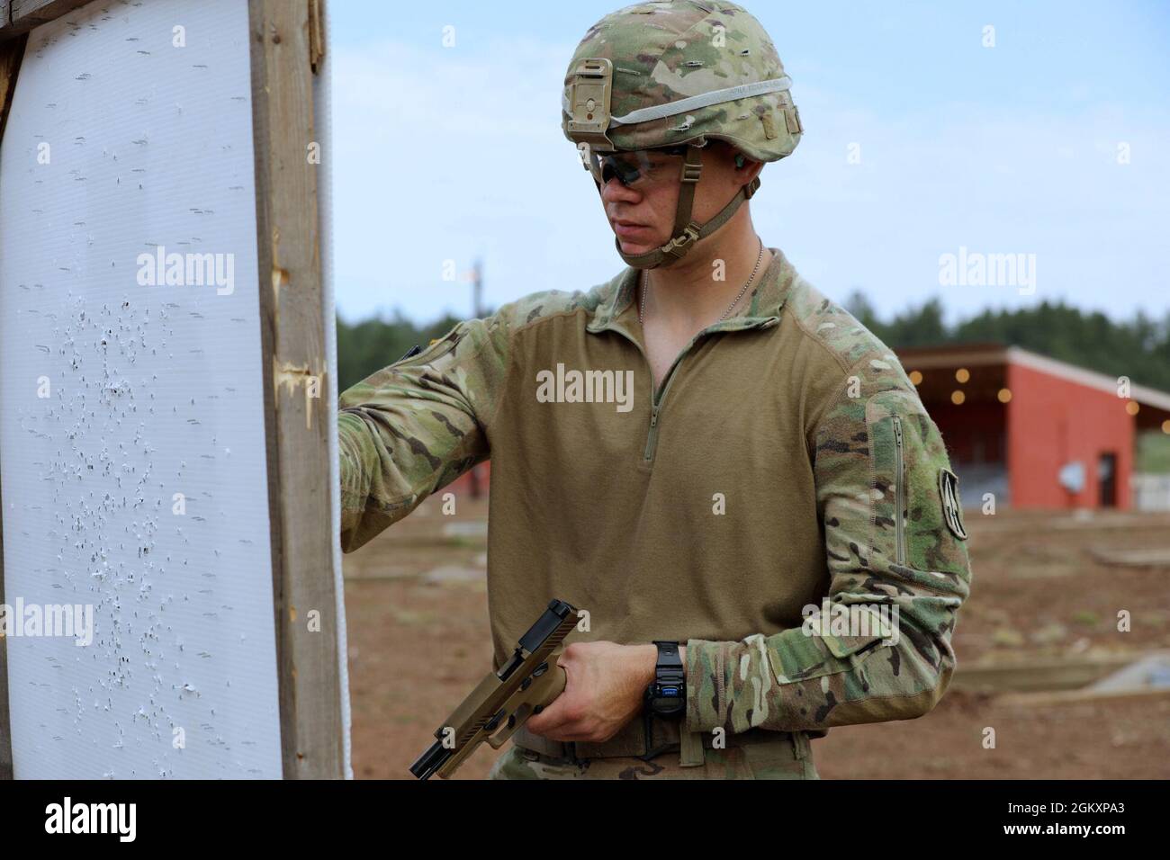 Spc. Henry Brucken, 1-151 Infantry, Indiana National Guard, reviews his ...