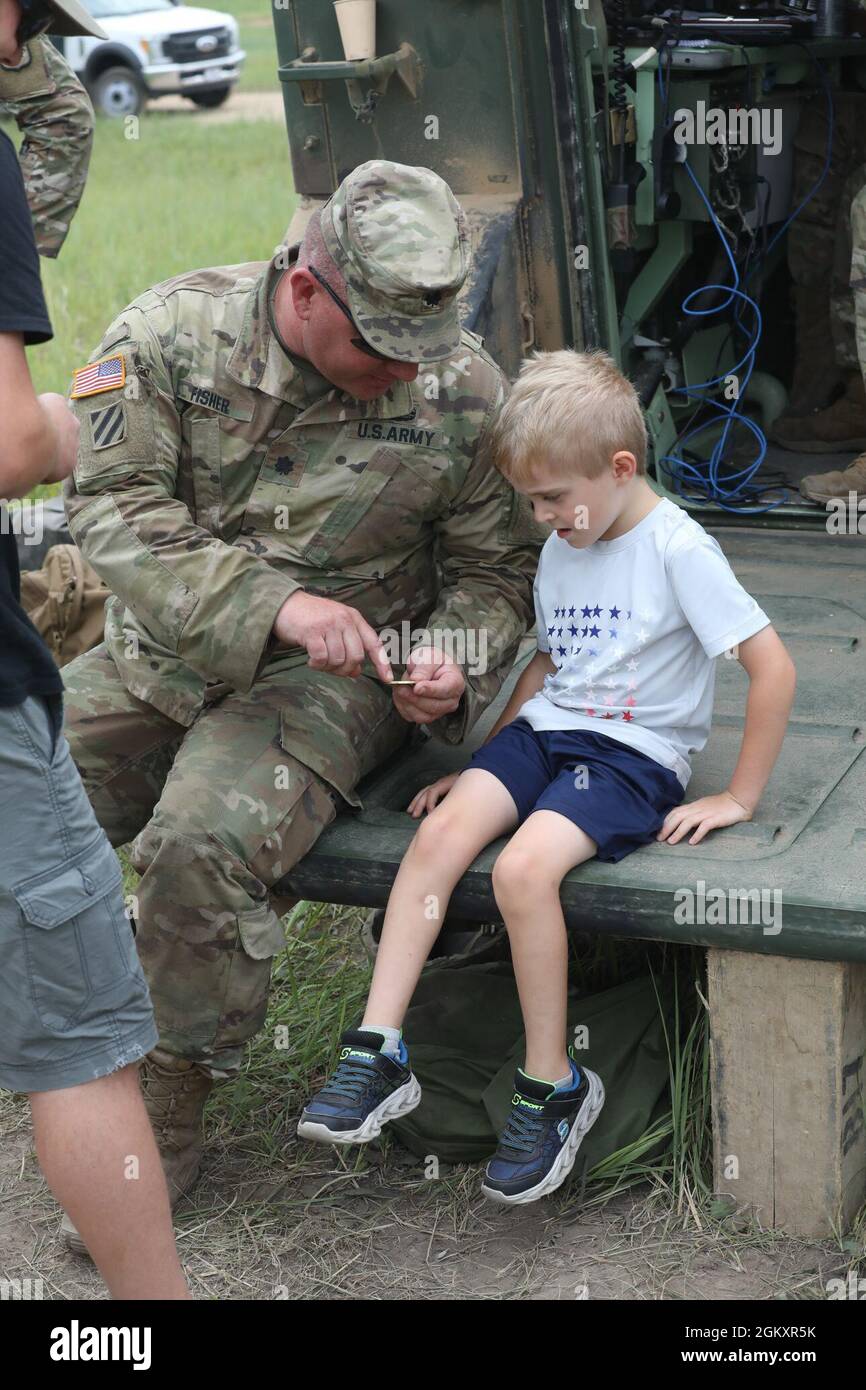 Lt. Col. Fisher from South Dakota National Guard gives a 1-147 FA coin ...