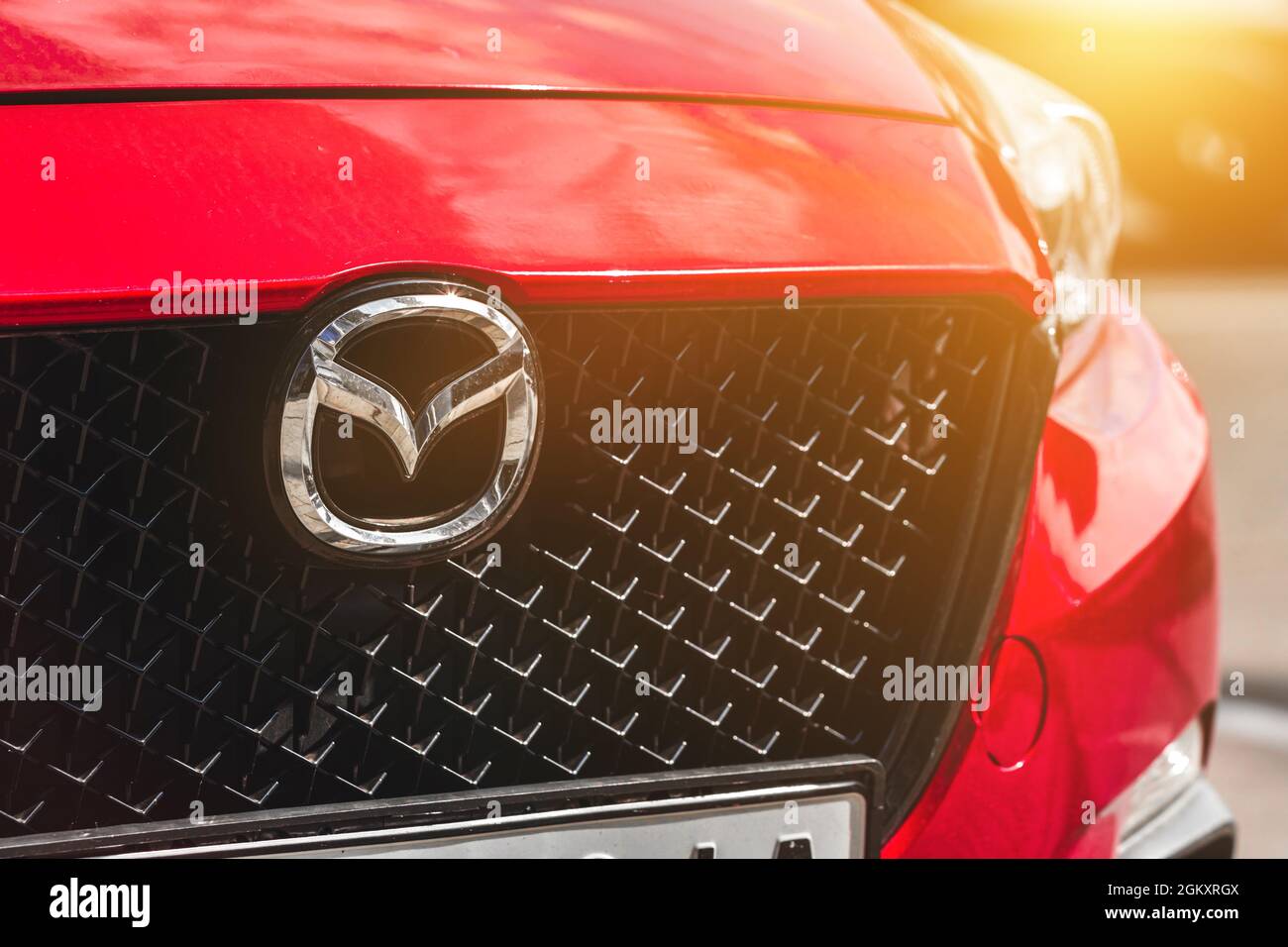 Kharkov, Ukraine - September 13, 2021: Mazda brand logo on a red car ...