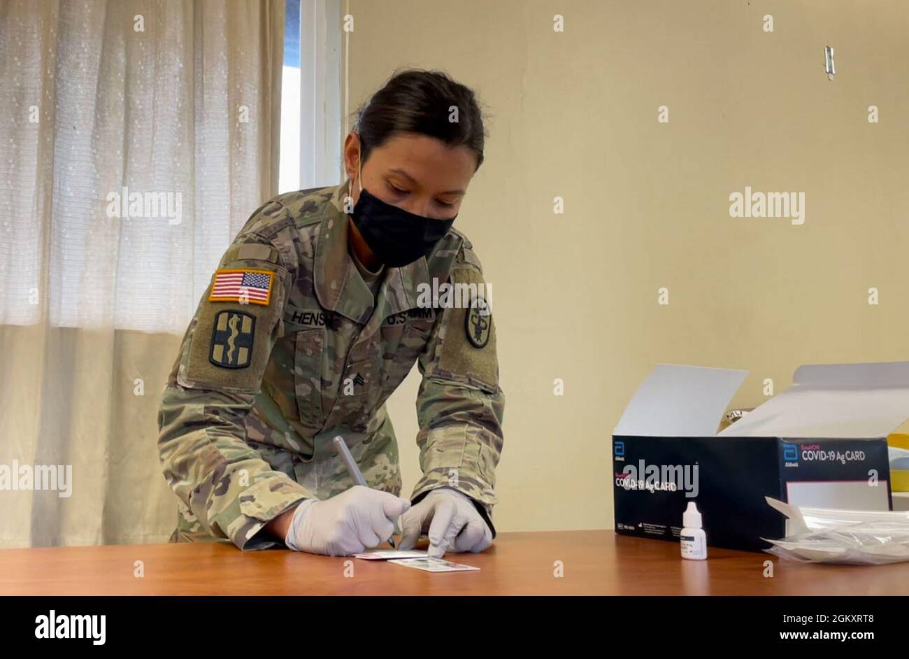 Sgt. Marissa Henson, Public Health Activity-Hawaii, prepares a COVID Ag ...