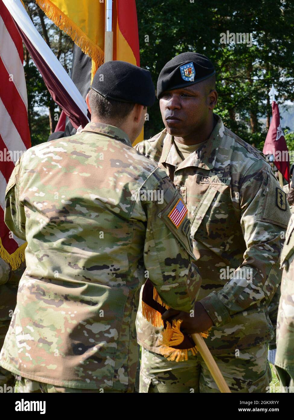 U.S. Army Col. Werner J. Barden, commander (left) passes the unit ...