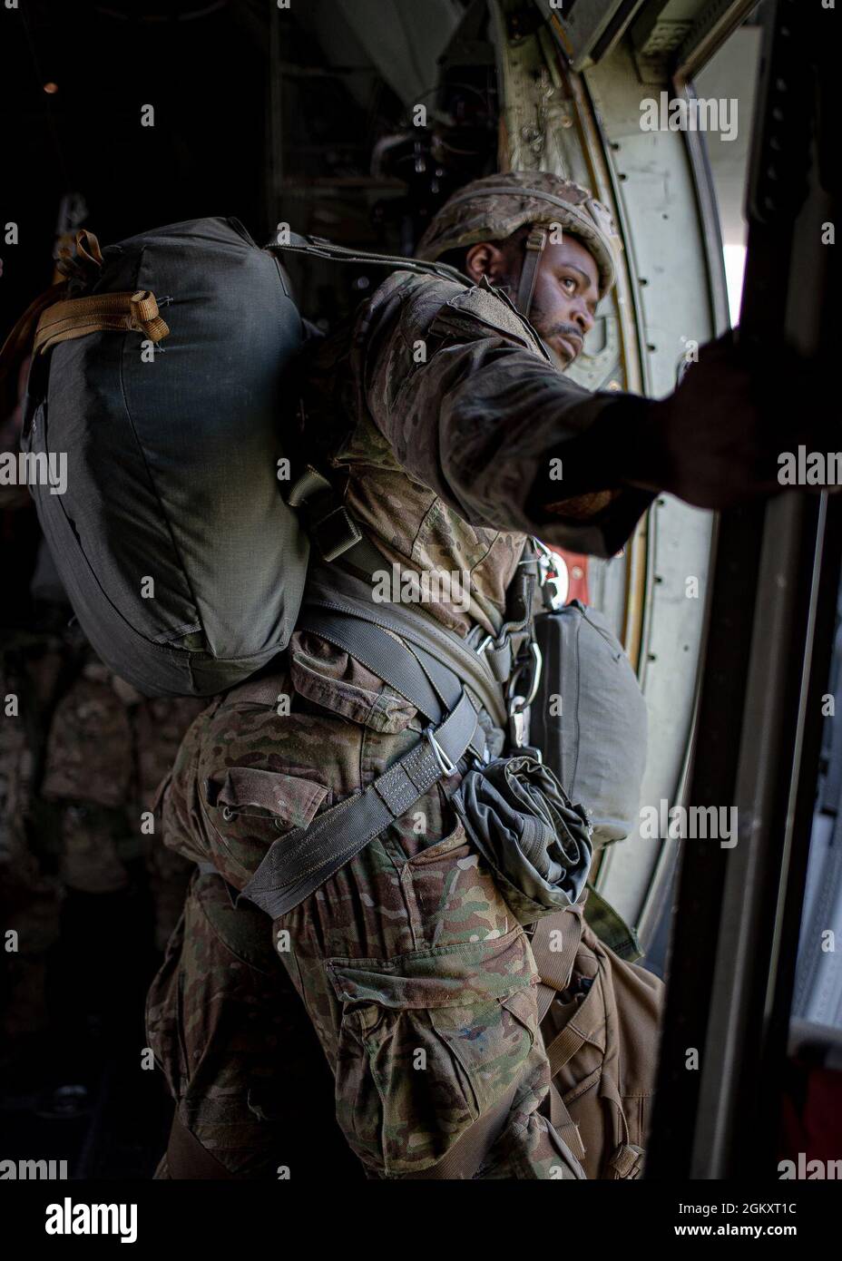 A U.S. Army jumpmaster assigned to the 173rd Airborne Brigade makes ...