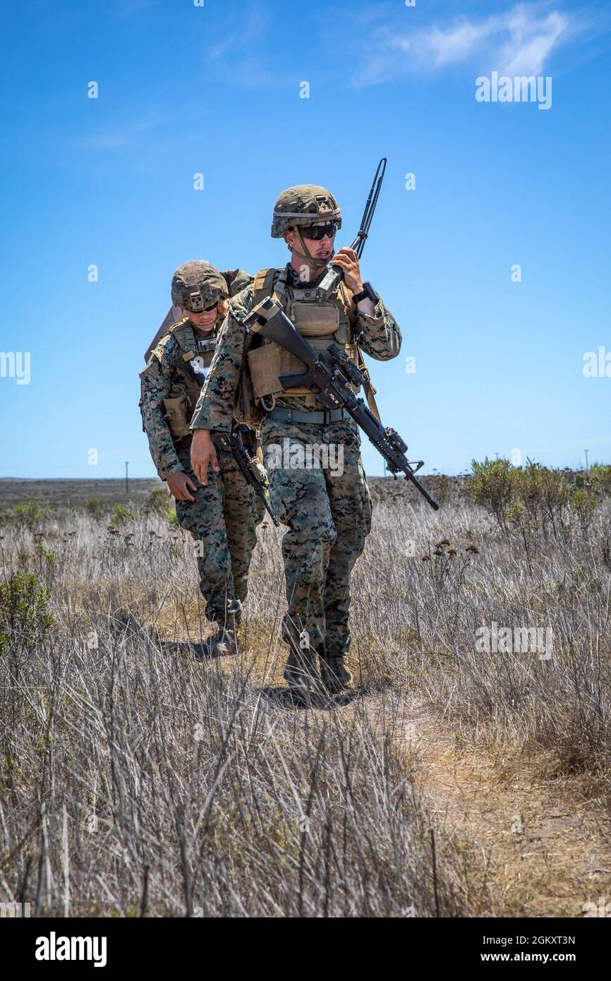 U.S. Marine Corps 1st Lt. Ryan J. Cassidy (left), a transmissions ...