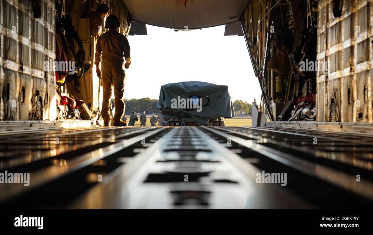 A loadmaster with to the 1st Special Operations Squadron marshals a ...