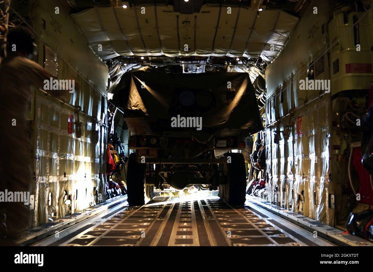 A loadmaster with to the 1st Special Operations Squadron marshals a ...