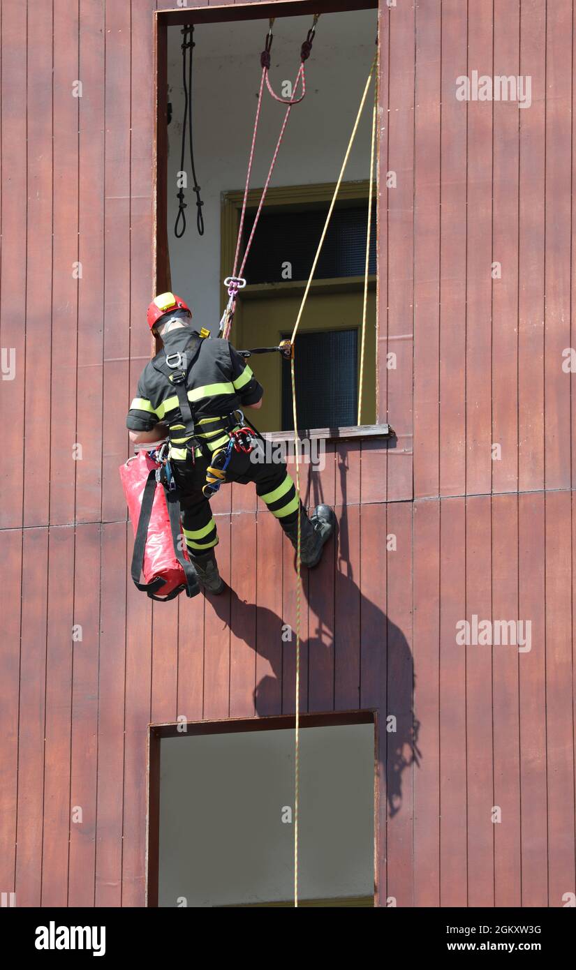brave Firefighter during a training for entry through the window during ...