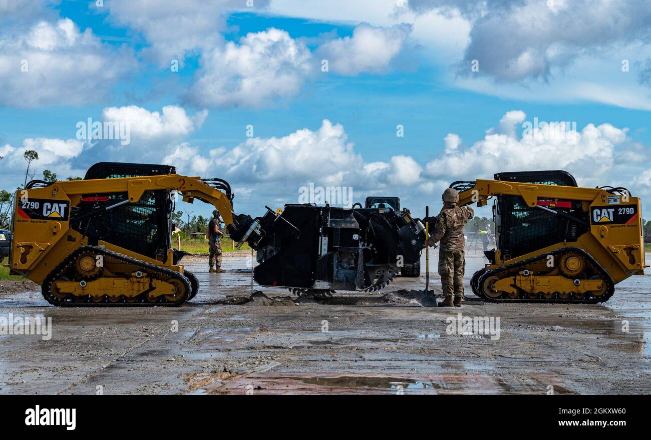 U.S. Airmen saw through the runway with track loaders during the Rapid ...