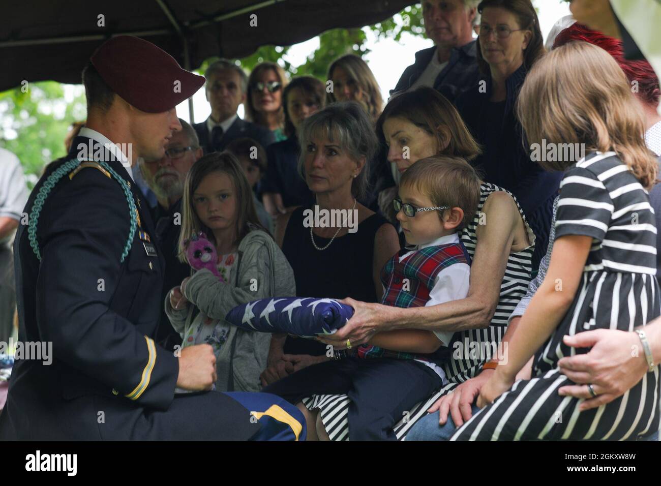 Capt. Theodore Erickson presents the American flag to the Family of 2nd ...
