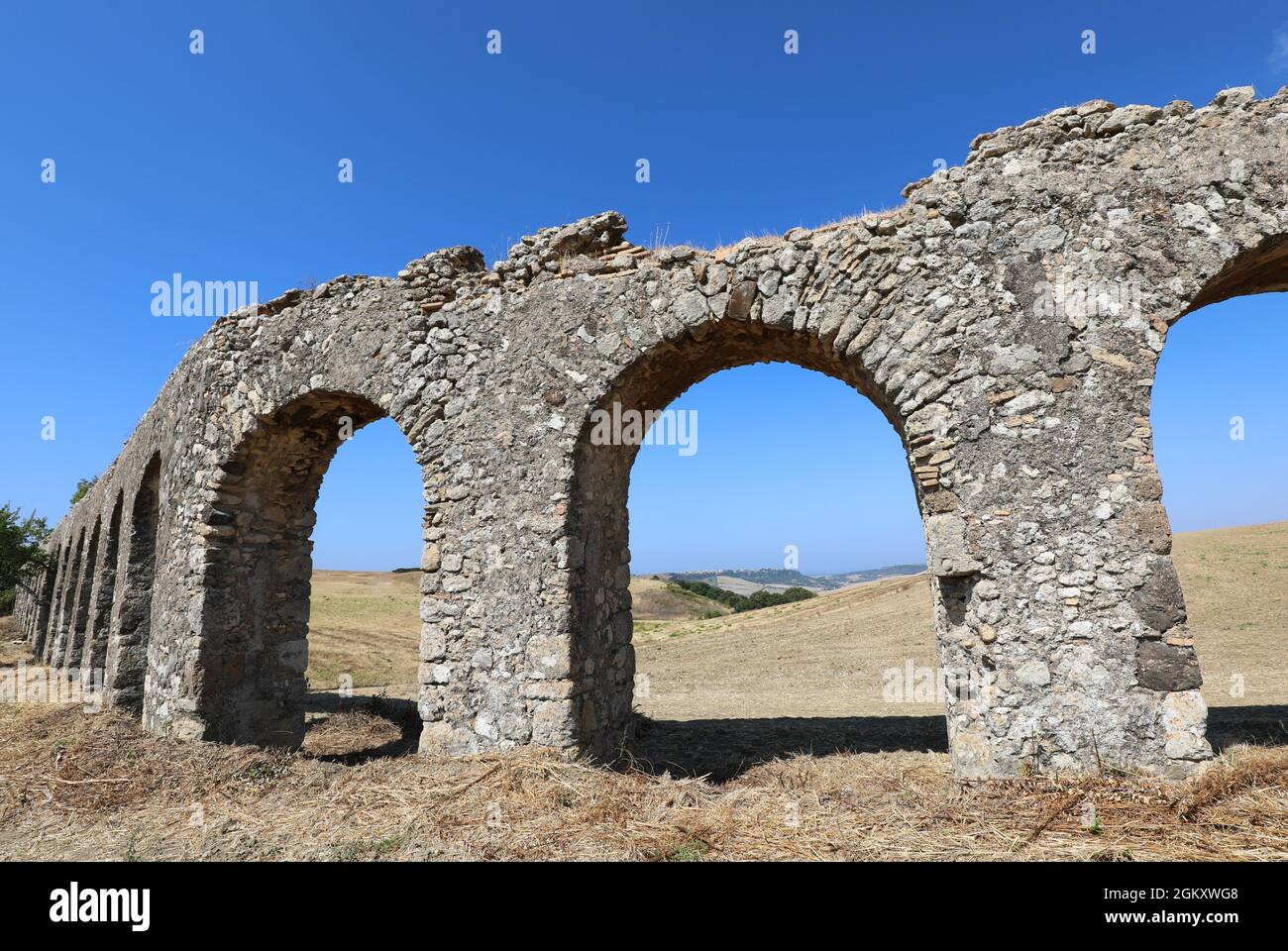 Old arches of an ancient Roman aqueduct that was used to bring drinking ...