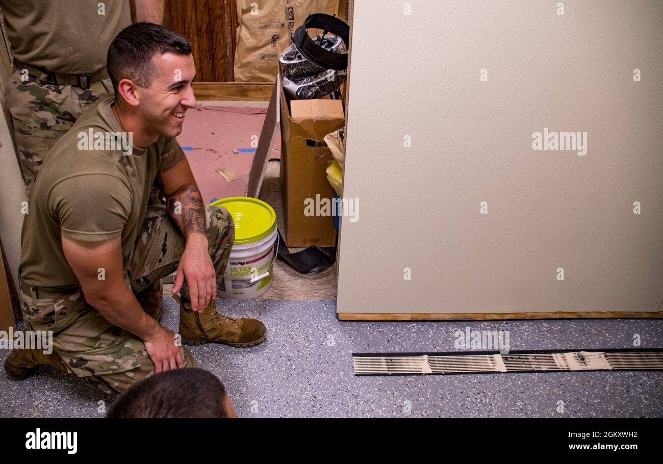 Members of the 143d Airlift Wing, Civil Engineer Squadron at a Command ...