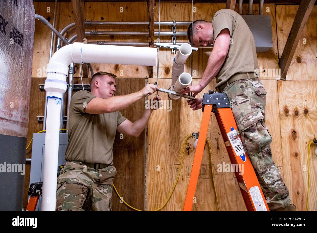 Members of the 143d Airlift Wing, Civil Engineer Squadron at a Command ...