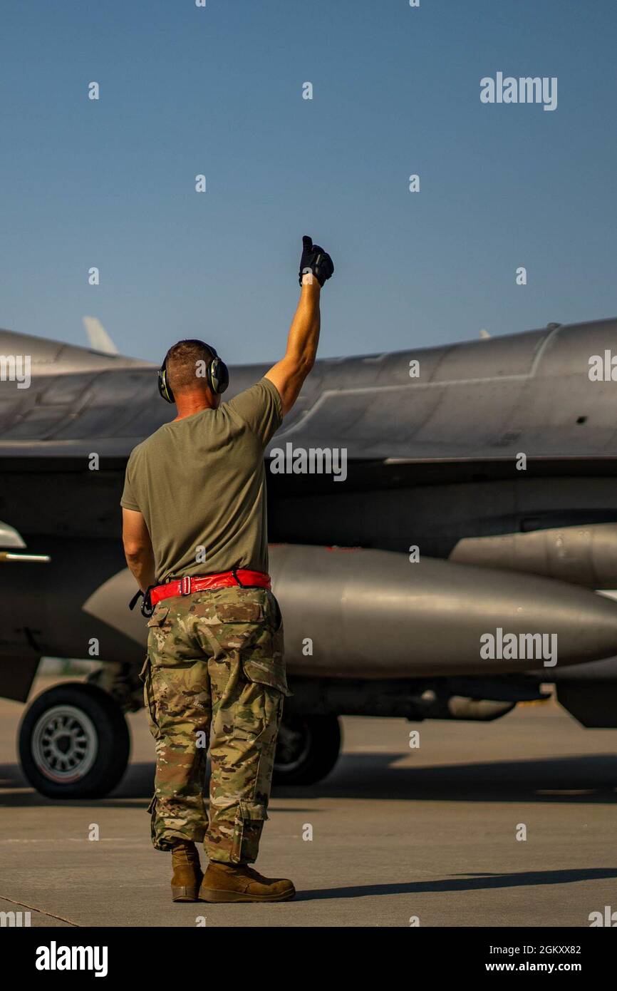 Master Sgt. Scott Meyer, 114th Aircraft Maintenance crew chief, gives a ...