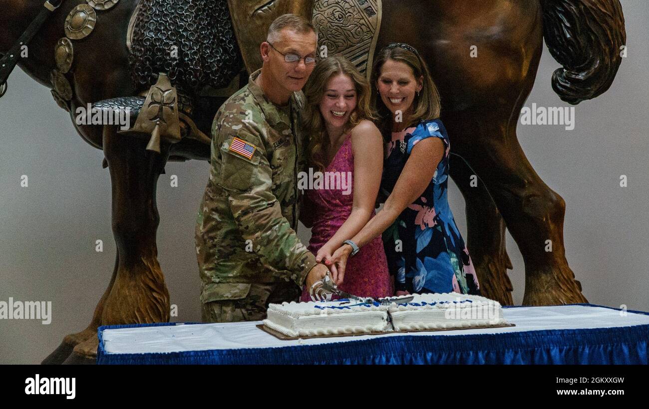 Maj. Gen. Steven W. Gilland and family cuts the cake during an ...