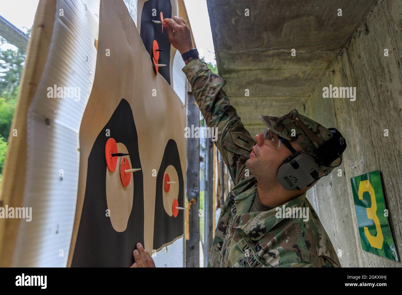 Staff Sgt. Devin Crawford, 108th Training Command, marks hits after an ...