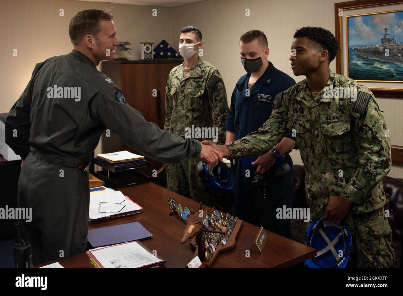 U.S. Navy Capt. Cassidy Norman, left, the commanding officer of the ...