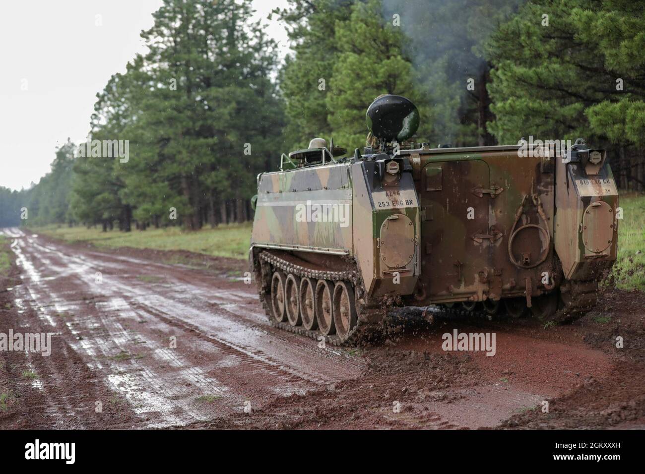 An M113 Armored Troop Carrier transported competitors to the start of ...