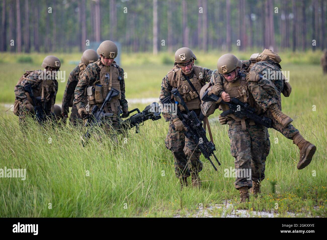 Students with the School of Infantry-East carry a simulated casualty ...