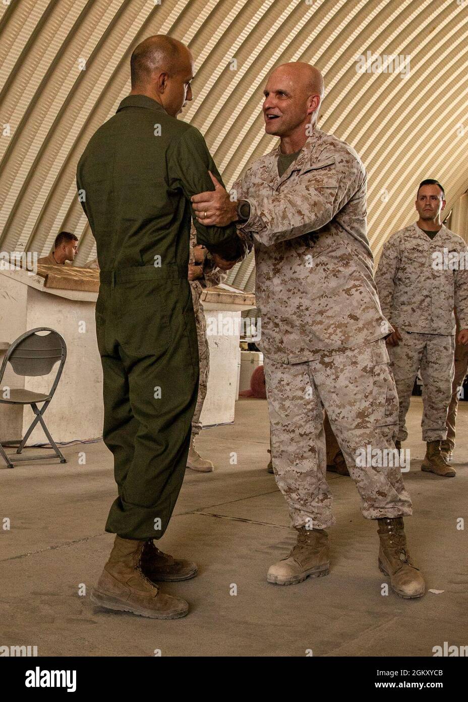 Lt. Gen. David G Bellon, Commander, Marine Forces Reserve and Marine Forces South, presents a ...