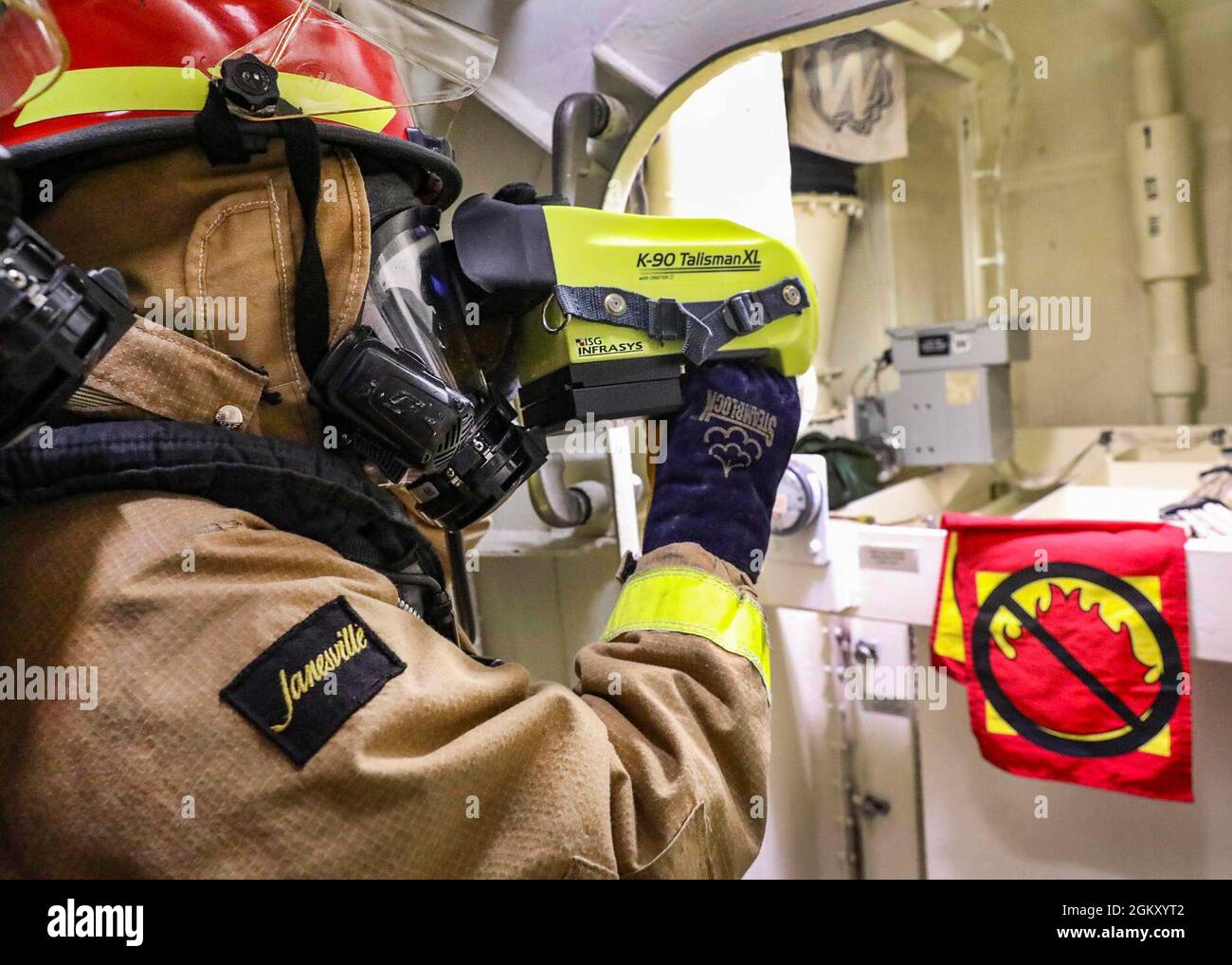 Damage Controlman 3rd Class Kentorian Hilson, from Albany, Ga., looks ...