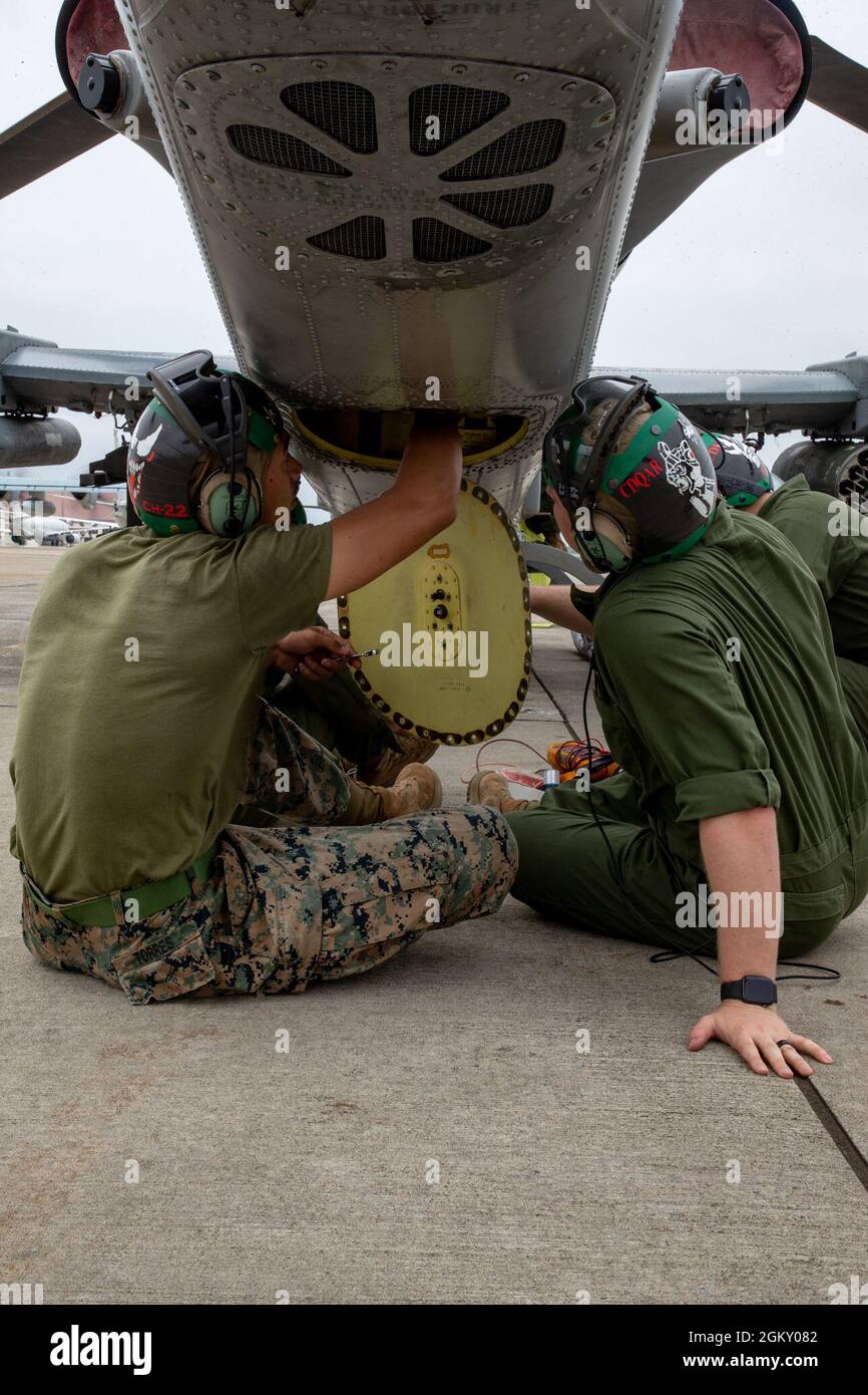 U.S. Marine Corps Staff Sgt. Philip Neal, left, and Cpl. Kimo Torres ...