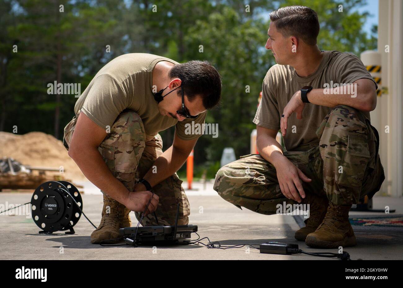 Explosive ordnance disposal technicians connect the Guardian 12 Digital ...