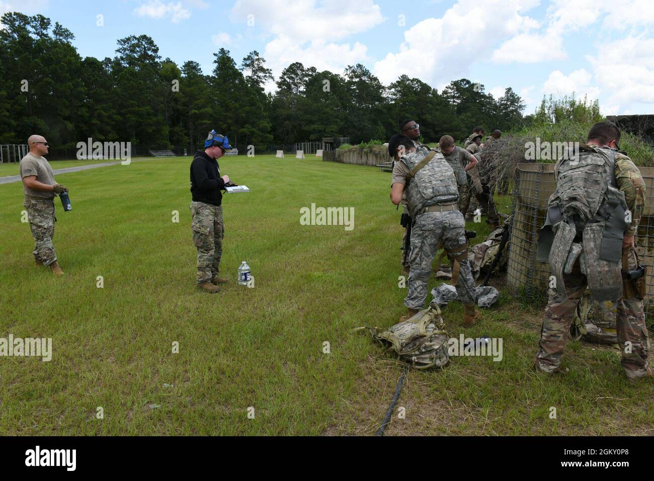 Master Sgt. McQuiggin, left, and Staff Sgt. Dylan Drenner, center, both ...