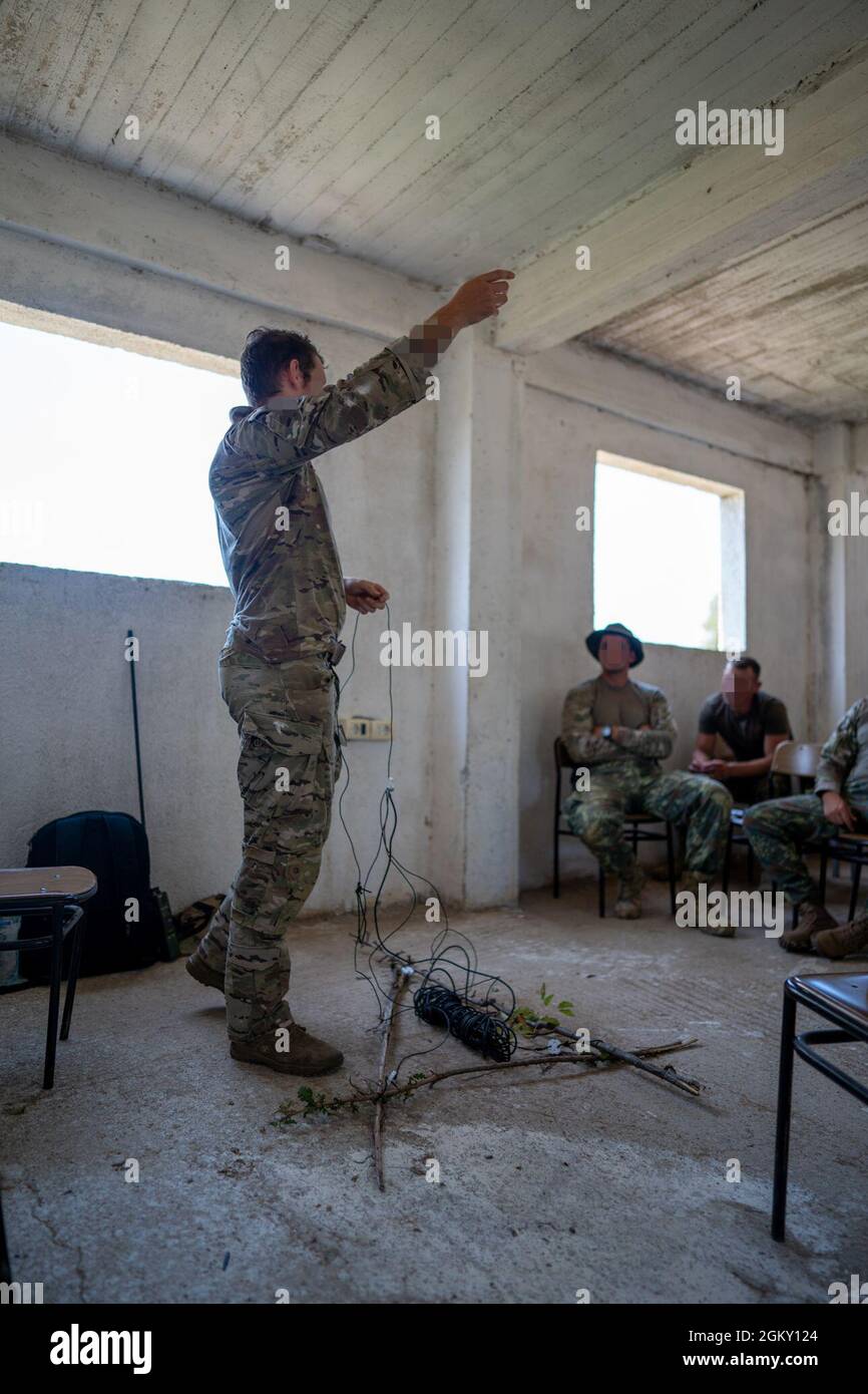 A U.S. Army Green Beret assigned to 10th Special Forces Group teaches ...