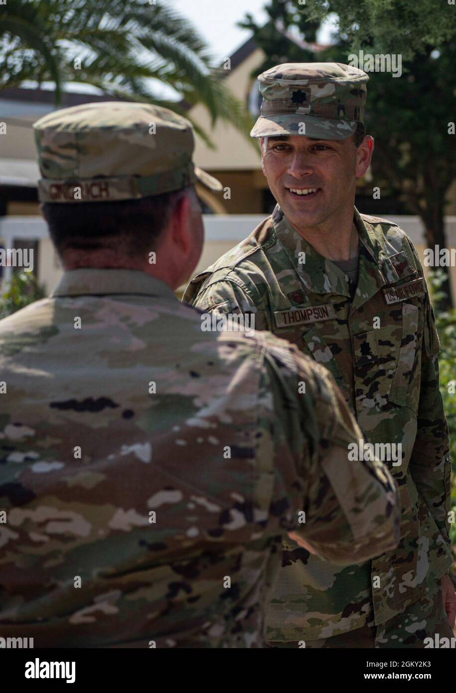 Lt. Col. Jared Thompson, 728th Air Mobility Squadron commander, shakes ...