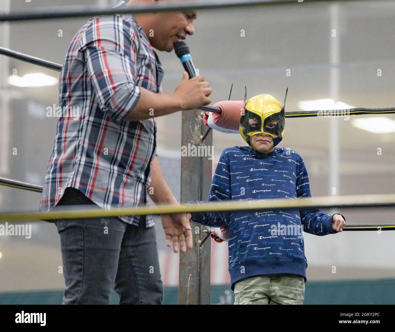 An Army kid gets a quick lesson from Lucha Frontera's DJ Voz during the ...