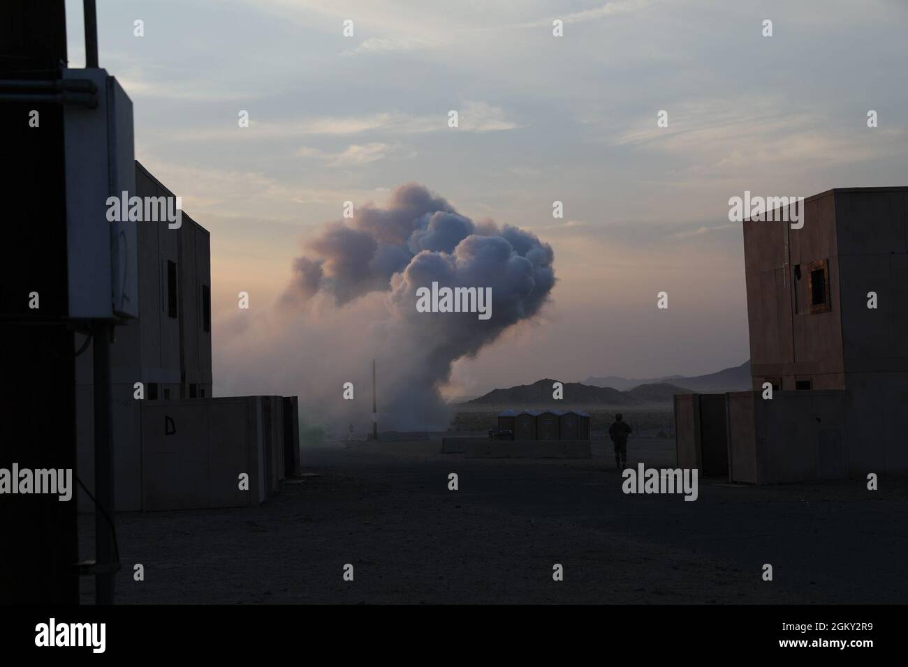 Smoke climbs above the mock city of Ujen as Soldiers of the 45th ...