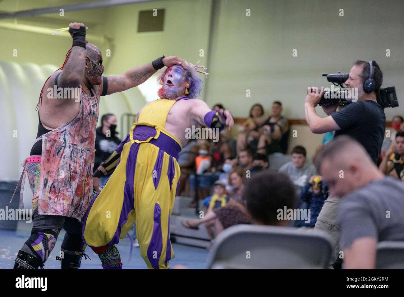Wrestlers grapple at the Lucha Libre wrestling event at Fort Bliss ...