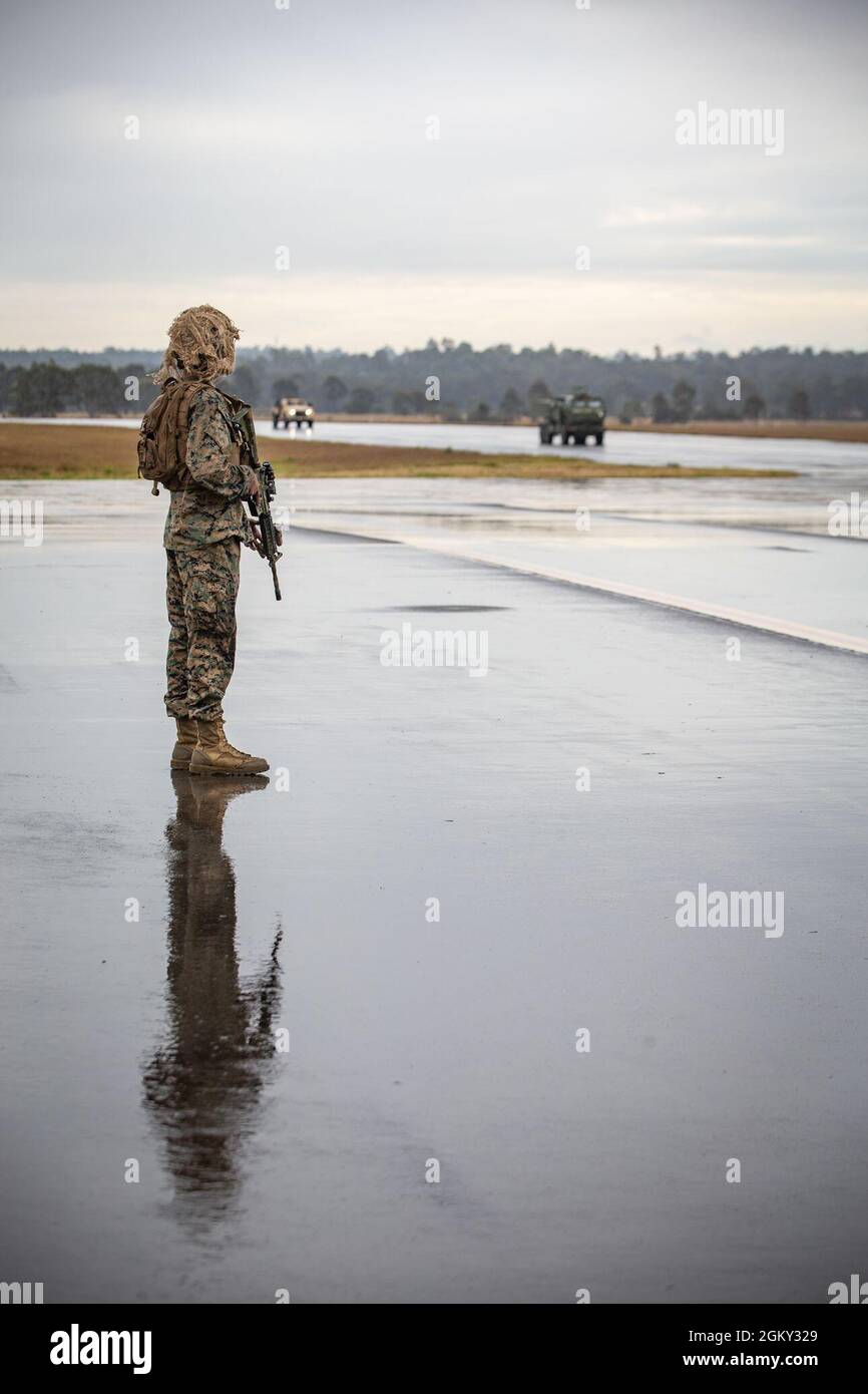 U.S. Marine Corps Lance Cpl. Chad Miller, a cannoneer with Golf Battery ...