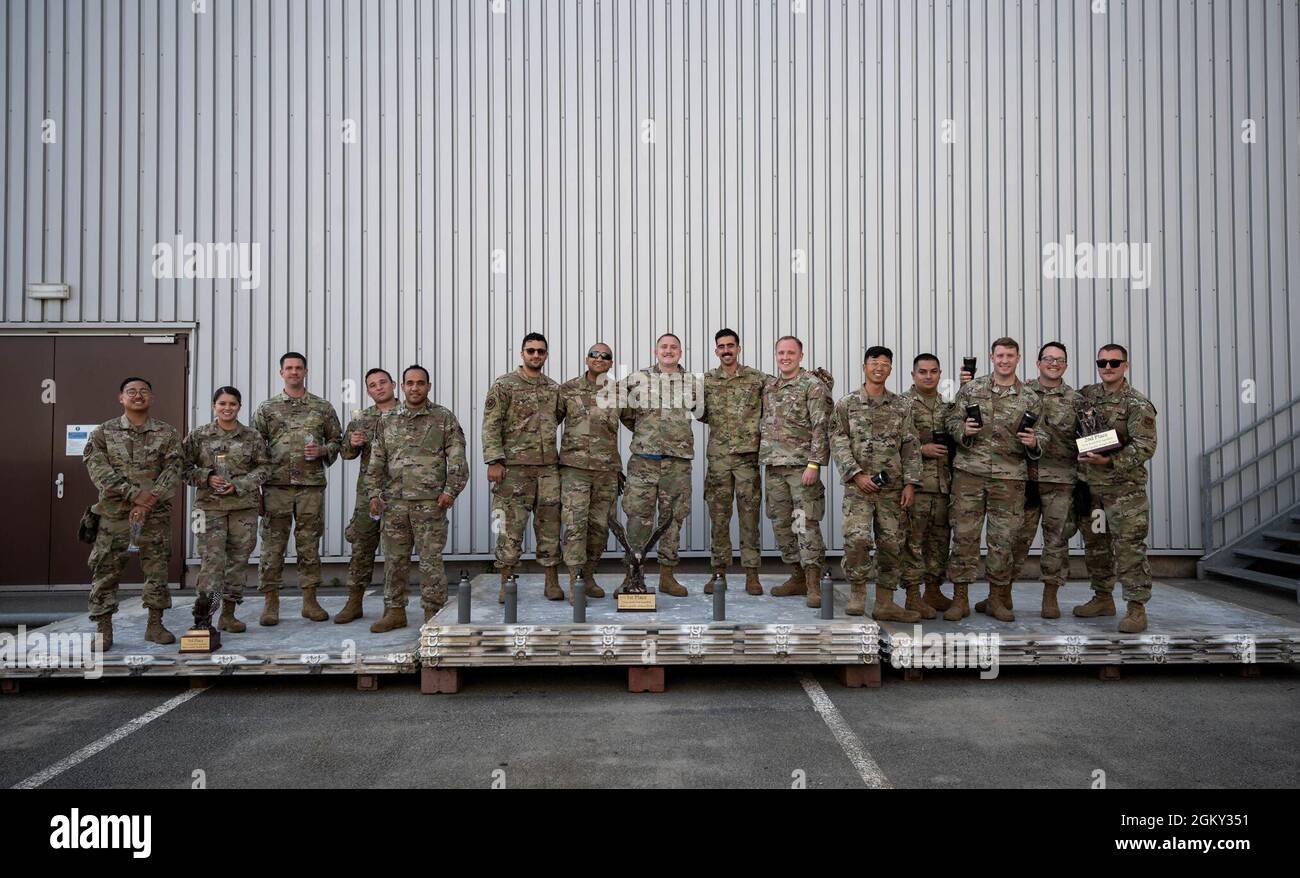 U.S. Air Force Airmen assigned to the 721st Aerial Port Squadron stand ...
