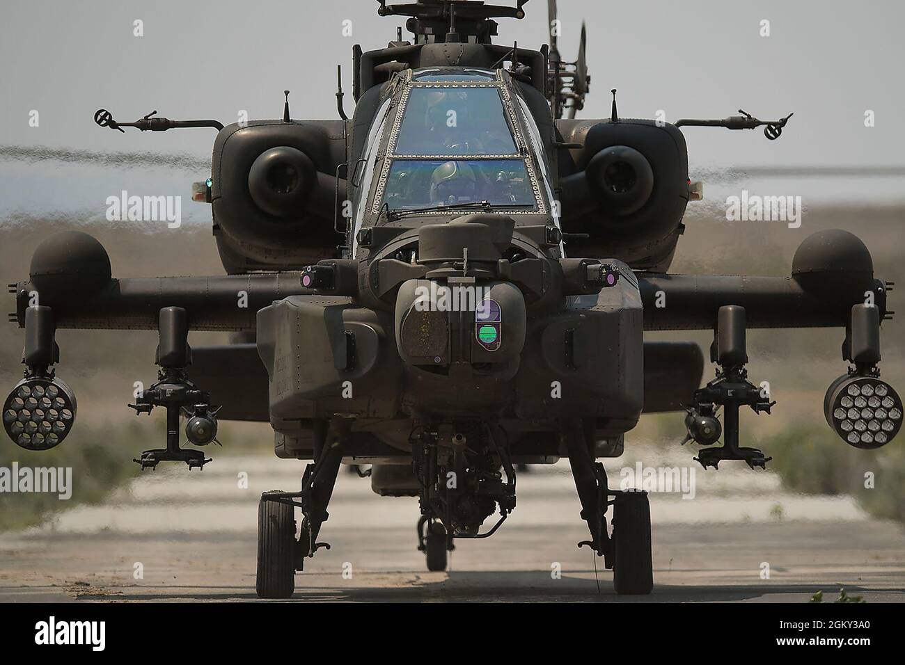 The second AH-64 Apache rolls onto the taxiway and to the takeoff pad ...