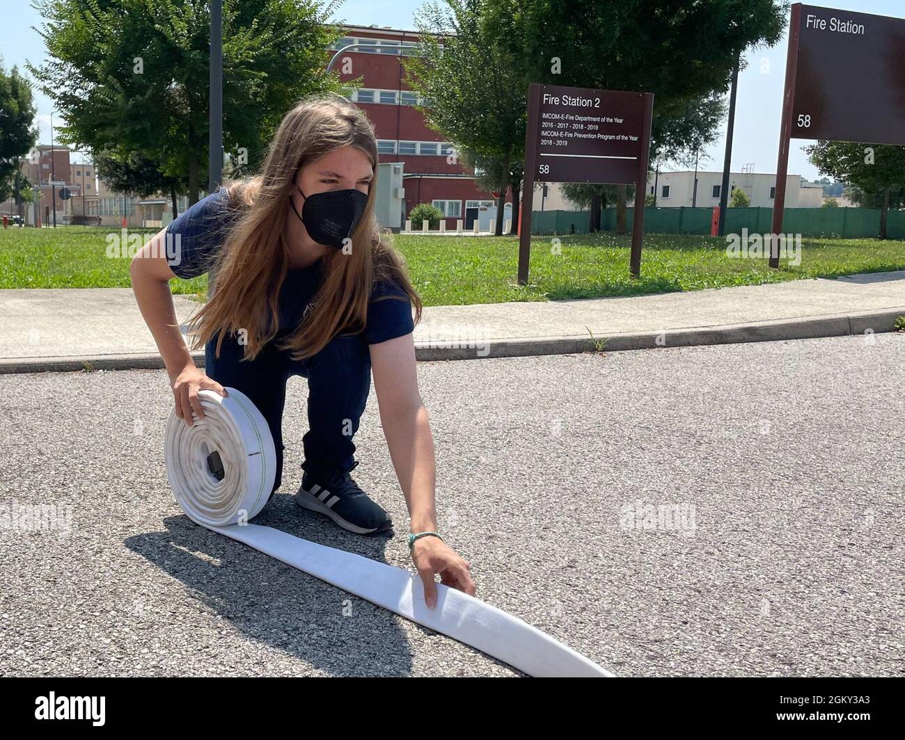 Charlie Wallace demonstrates the proper way to roll a fire hose ...