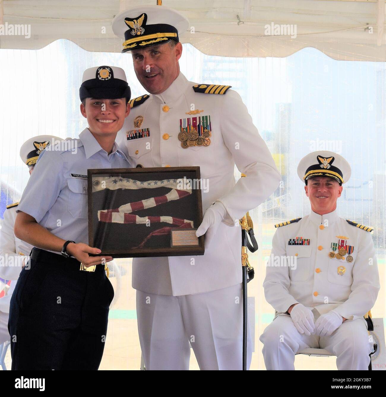 Capt. Timothy Cronin and Seaman Cheyenne Solis Headlam pose for a photo ...
