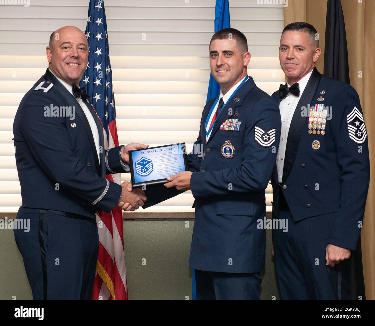 A promotee poses for a photo with Col. Patrick Miller, 88th Air Base ...