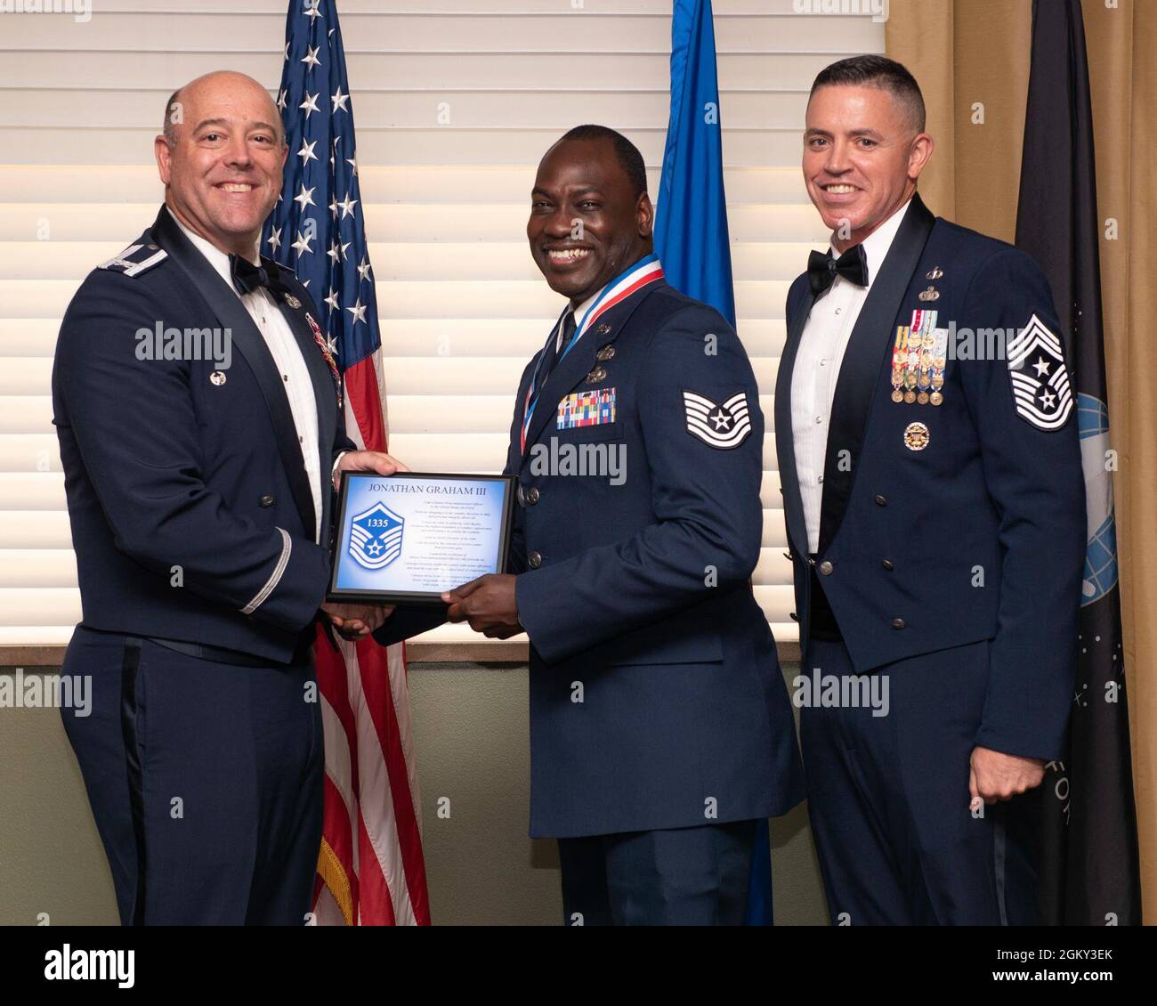 A promotee poses for a photo with Col. Patrick Miller, 88th Air Base ...