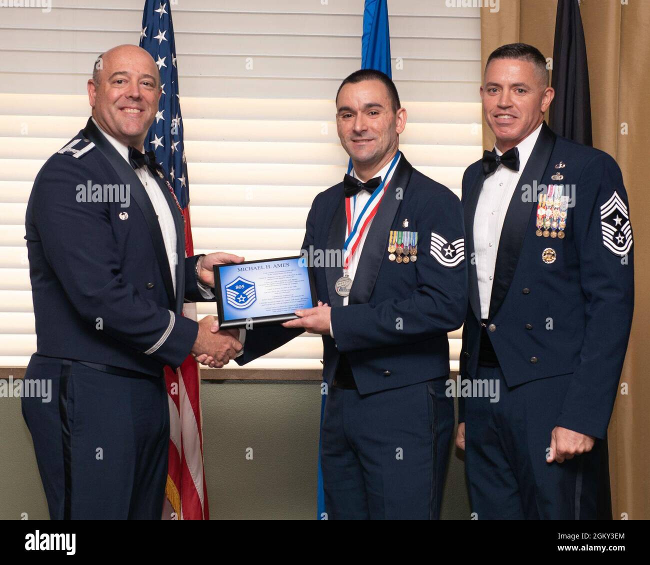 A promotee poses for a photo with Col. Patrick Miller, 88th Air Base ...